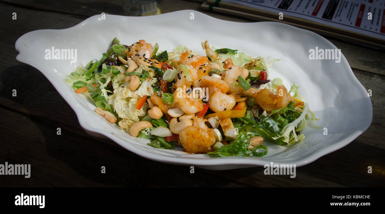 Fresh fish salad with nuts Stock Photo - Alamy