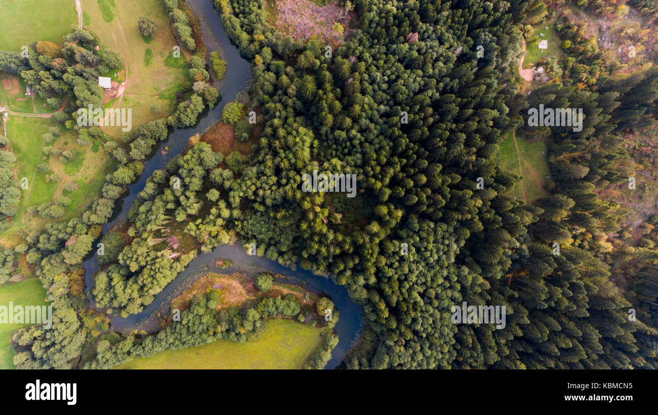 Aerial view of river bend through forest Stock Photo - Alamy