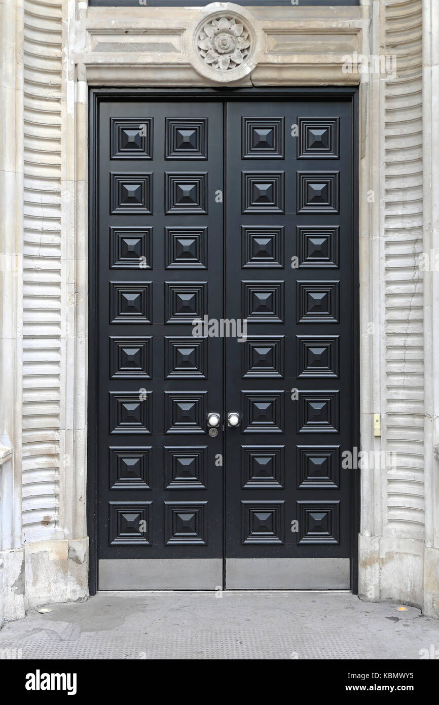 Closed big double black door Stock Photo - Alamy