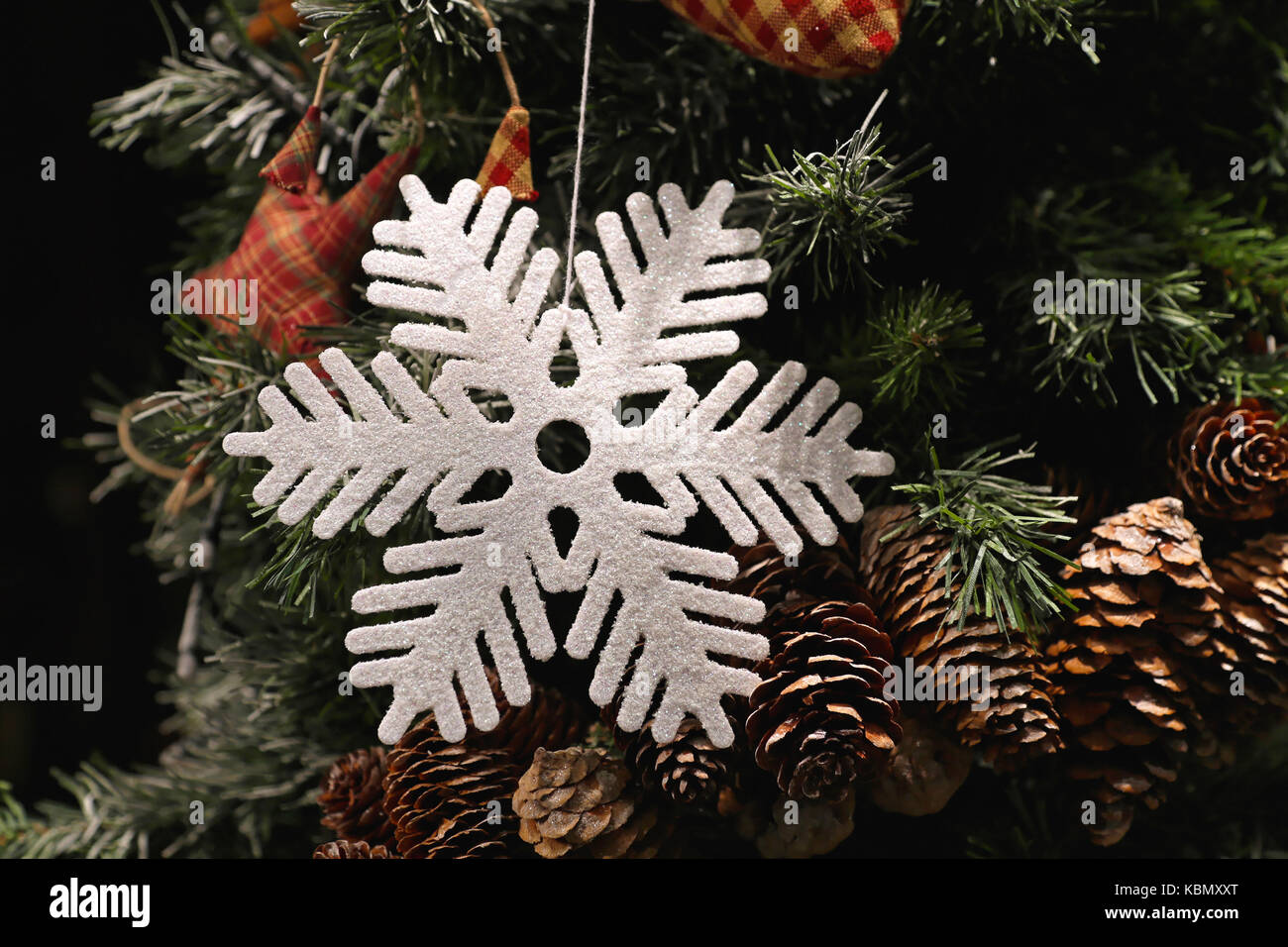 Snow flake decoration at Christmas tree Stock Photo - Alamy