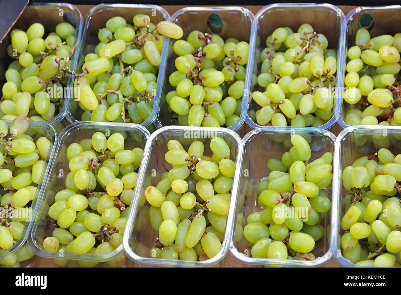 Seedless grapes in plastic trays for sale Stock Photo - Alamy