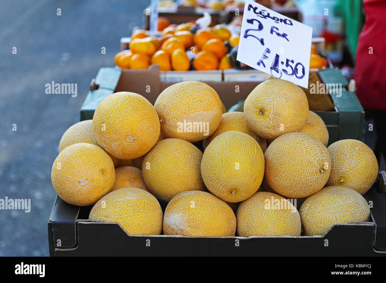 Honeydew melons in crate at market Stock Photo - Alamy