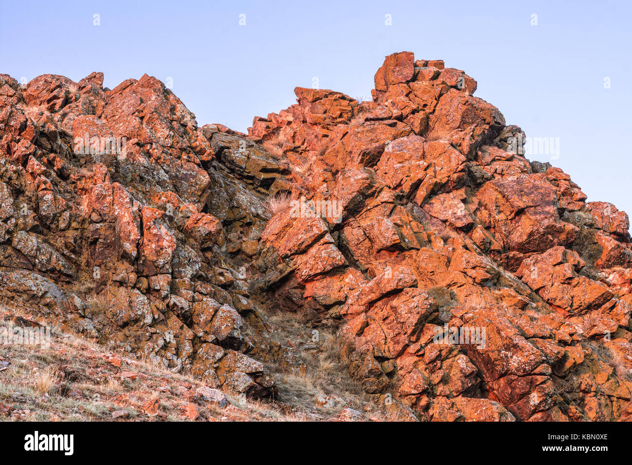 sunlit huge granite rock at beautiful sunset Stock Photo - Alamy