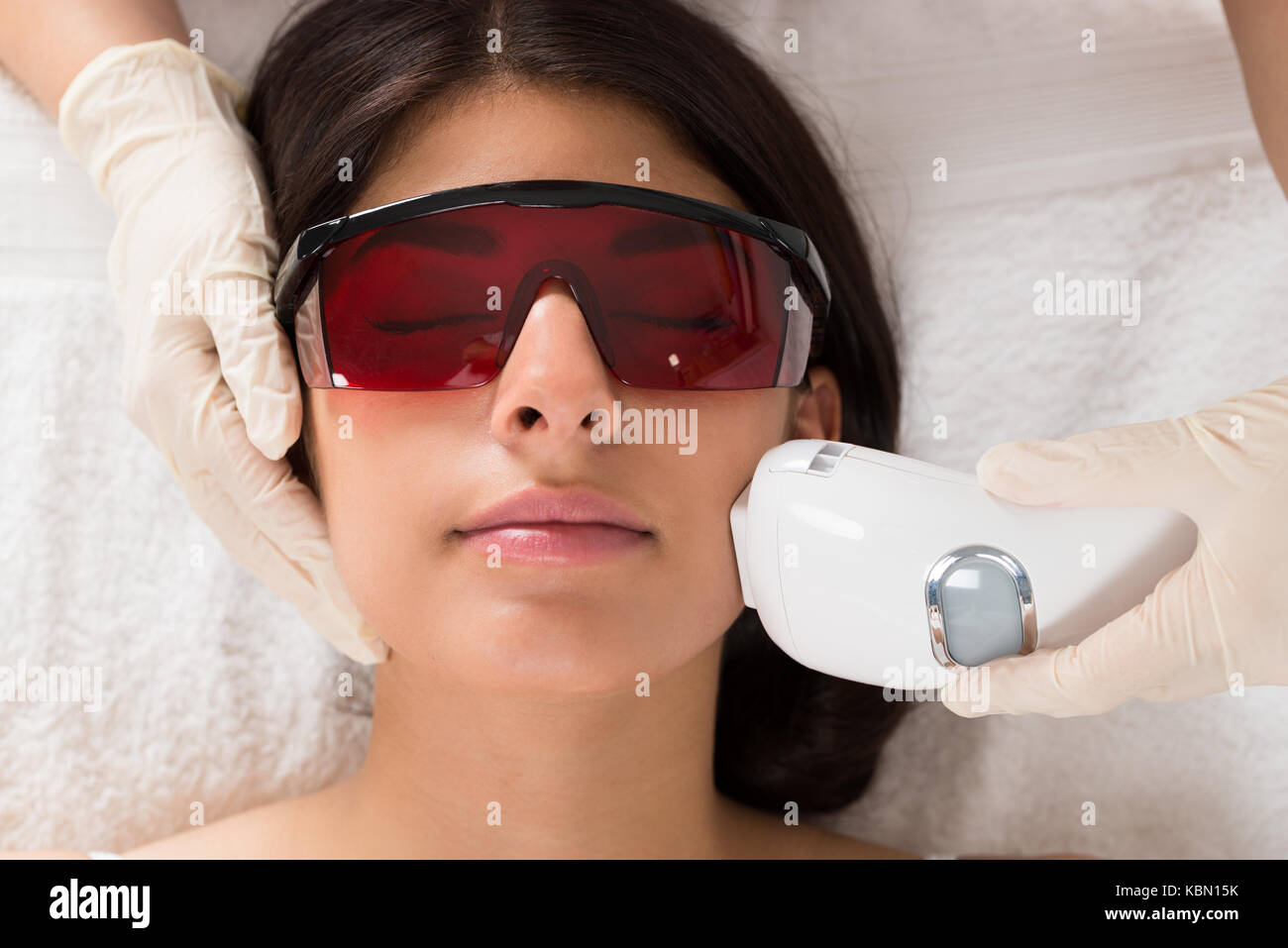 Close-up Of Beautician Giving Epilation Laser Treatment On Woman's Face ...