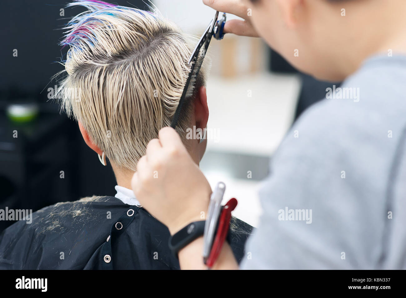 Women's haircut. Hairdresser, beauty salon. Professional hairdresser ...