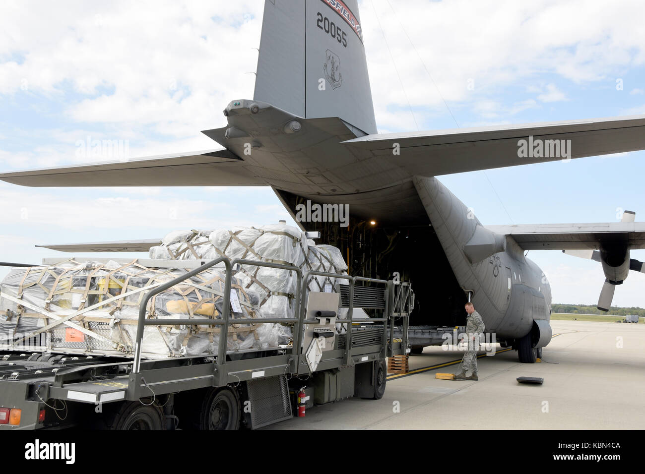 Equipment being loaded on a C-130 Hercules Stock Photo - Alamy