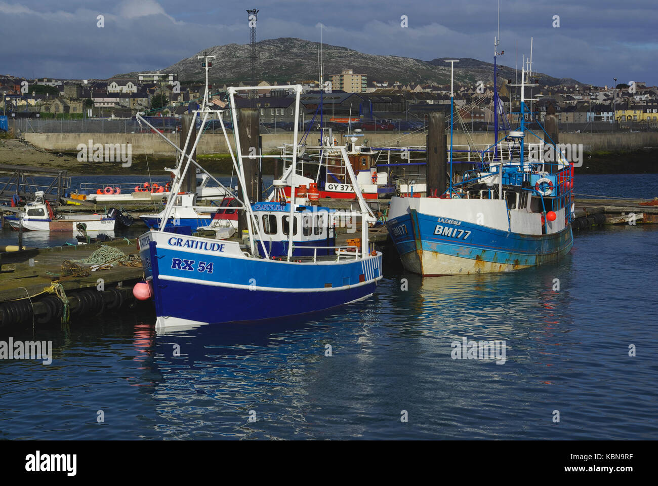 Fishing boats moored in Holyhead Harbour Stock Photo - Alamy