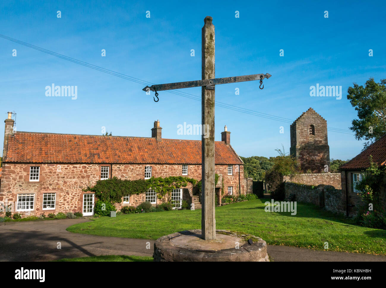 Sunny day in Stenton village green, East Lothian, Scotland, UK with red ...