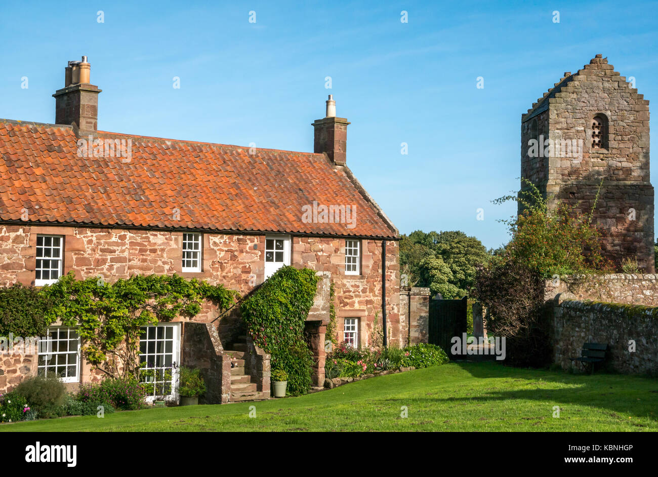 Sunny day in Stenton village green, East Lothian, Scotland, UK with red ...