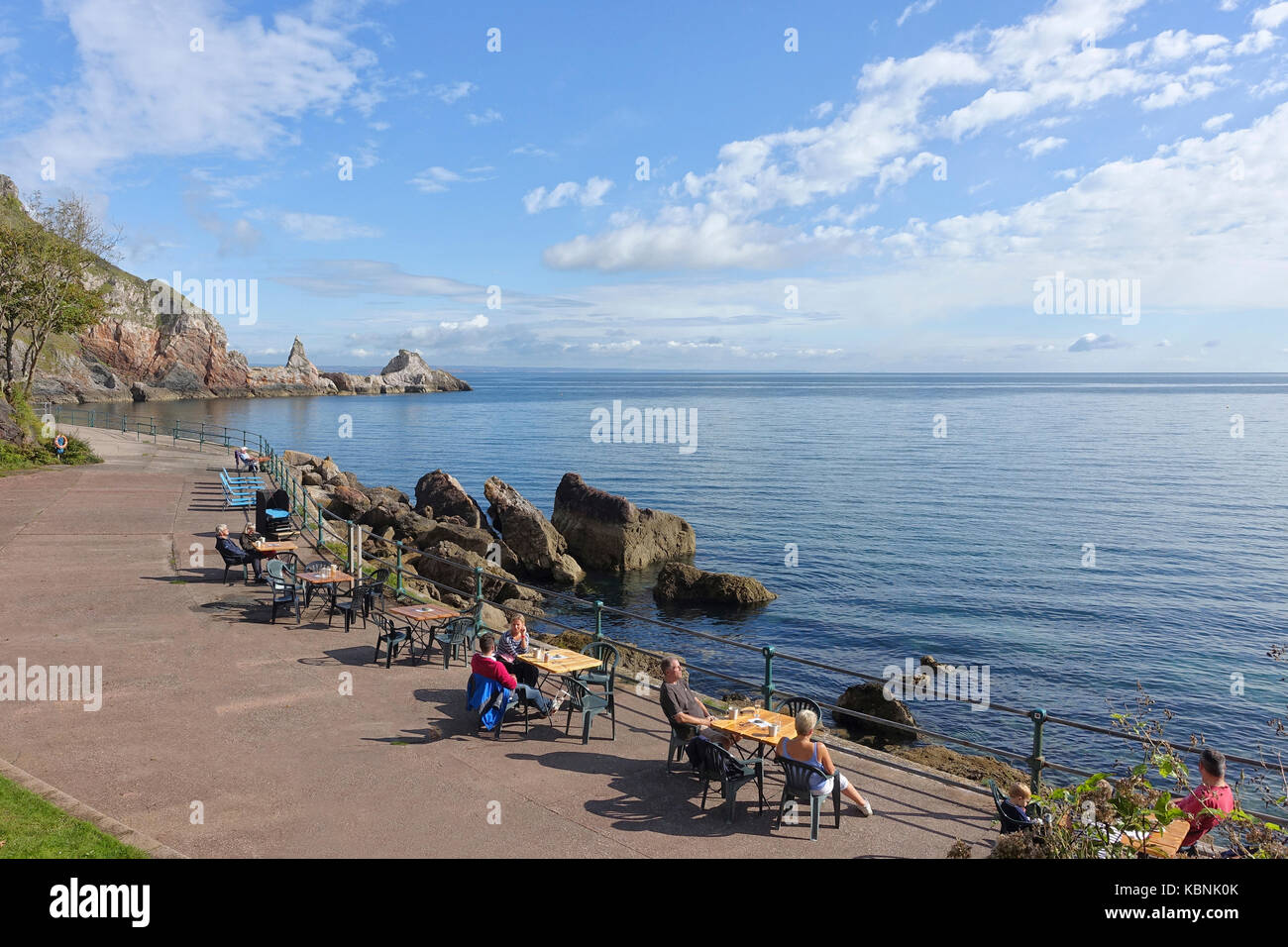 Vistors to Anstey's Cove, Torquay, Devon relax on the terrace of the ...