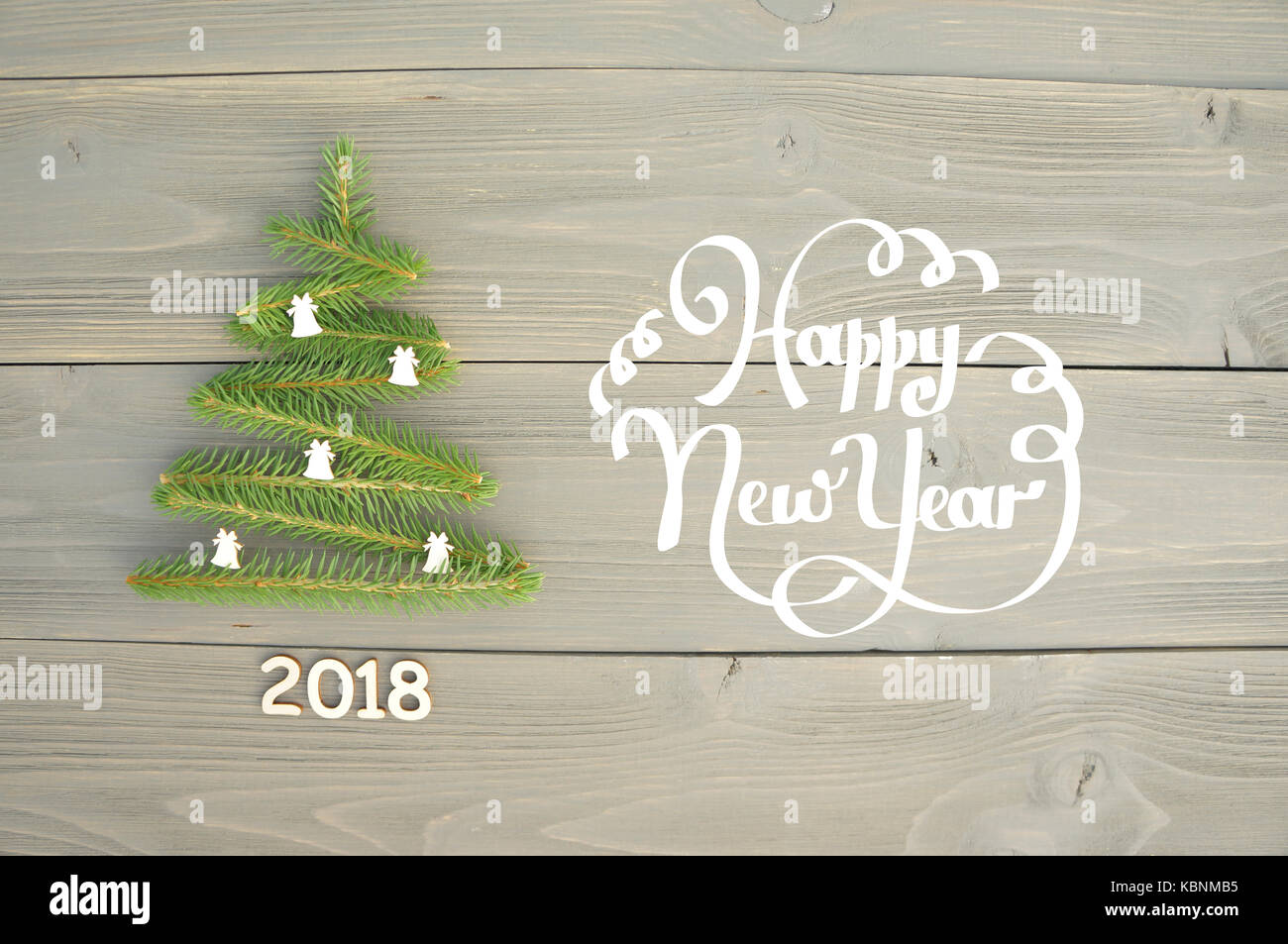 Christmas tree on wooden background. Happy new year Stock Photo - Alamy