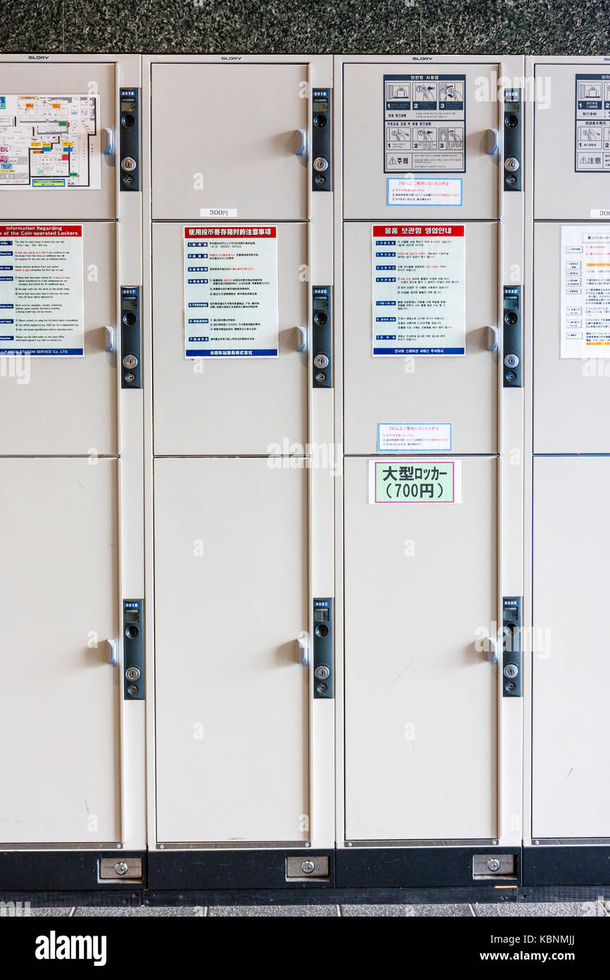 Japan, Kyoto. Kyoto station, three sizes of lockers stacked atop of ...