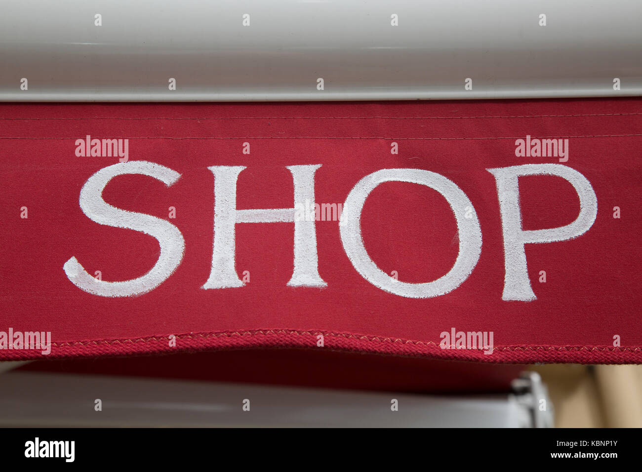 Red and White Shop Sign Stock Photo - Alamy