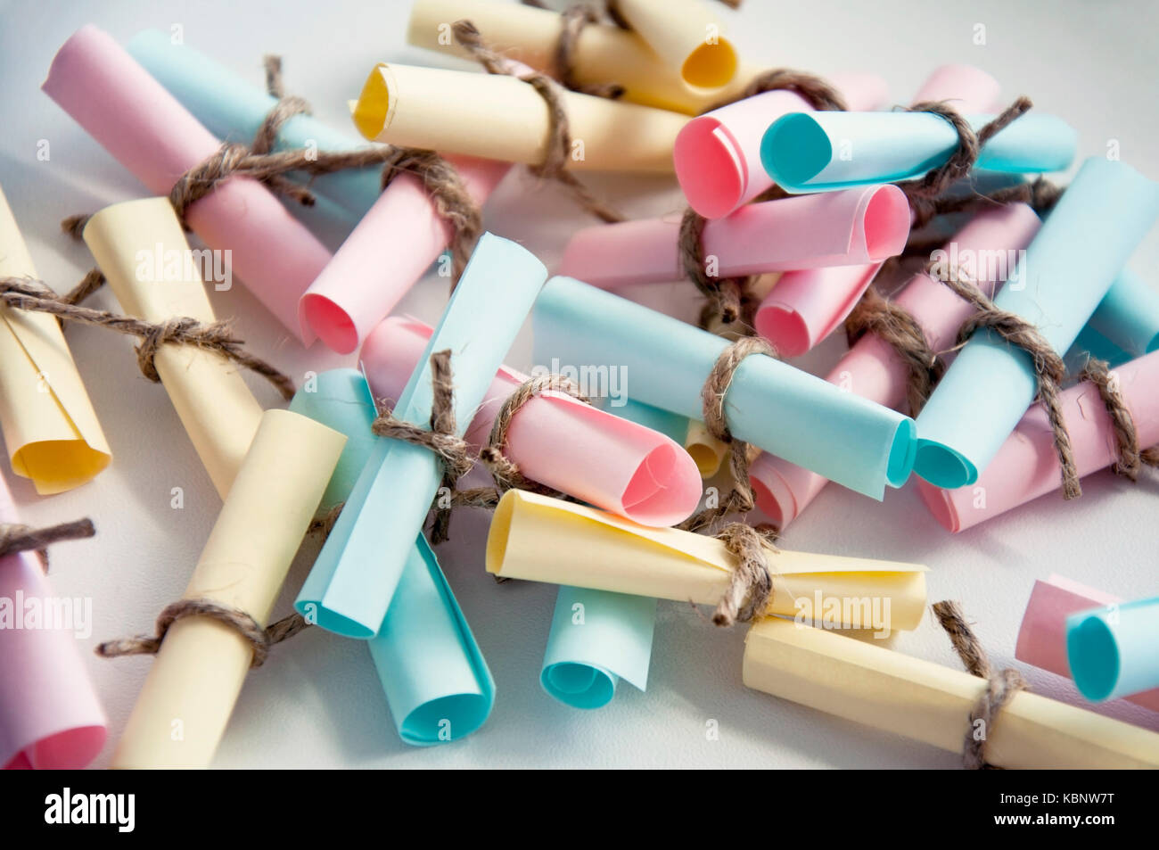 Glass jar with colored notes with blur and toning Stock Photo - Alamy