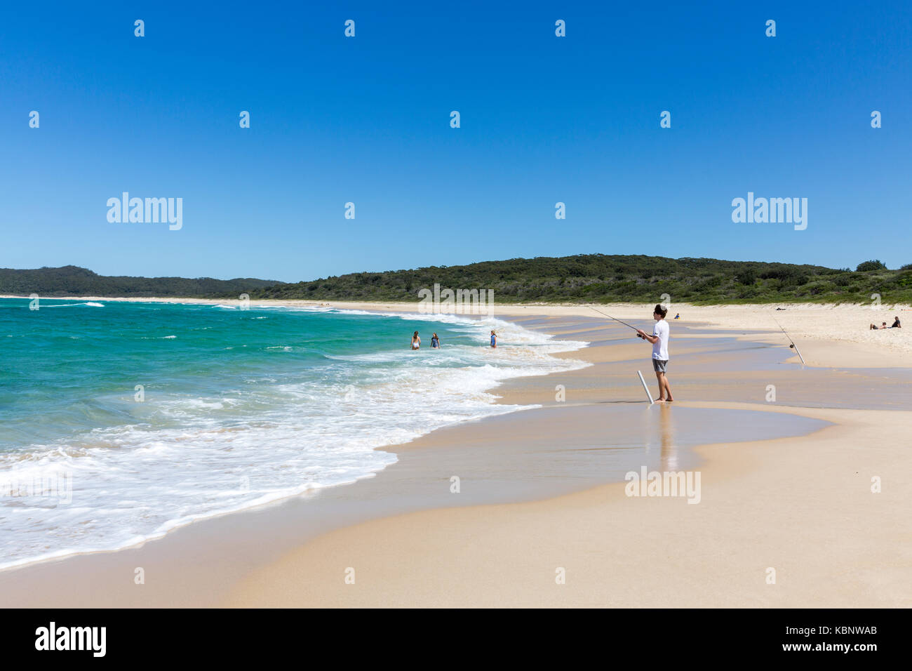 Man fishing at Cellito beach at Sandbar on the mid north coast of new ...
