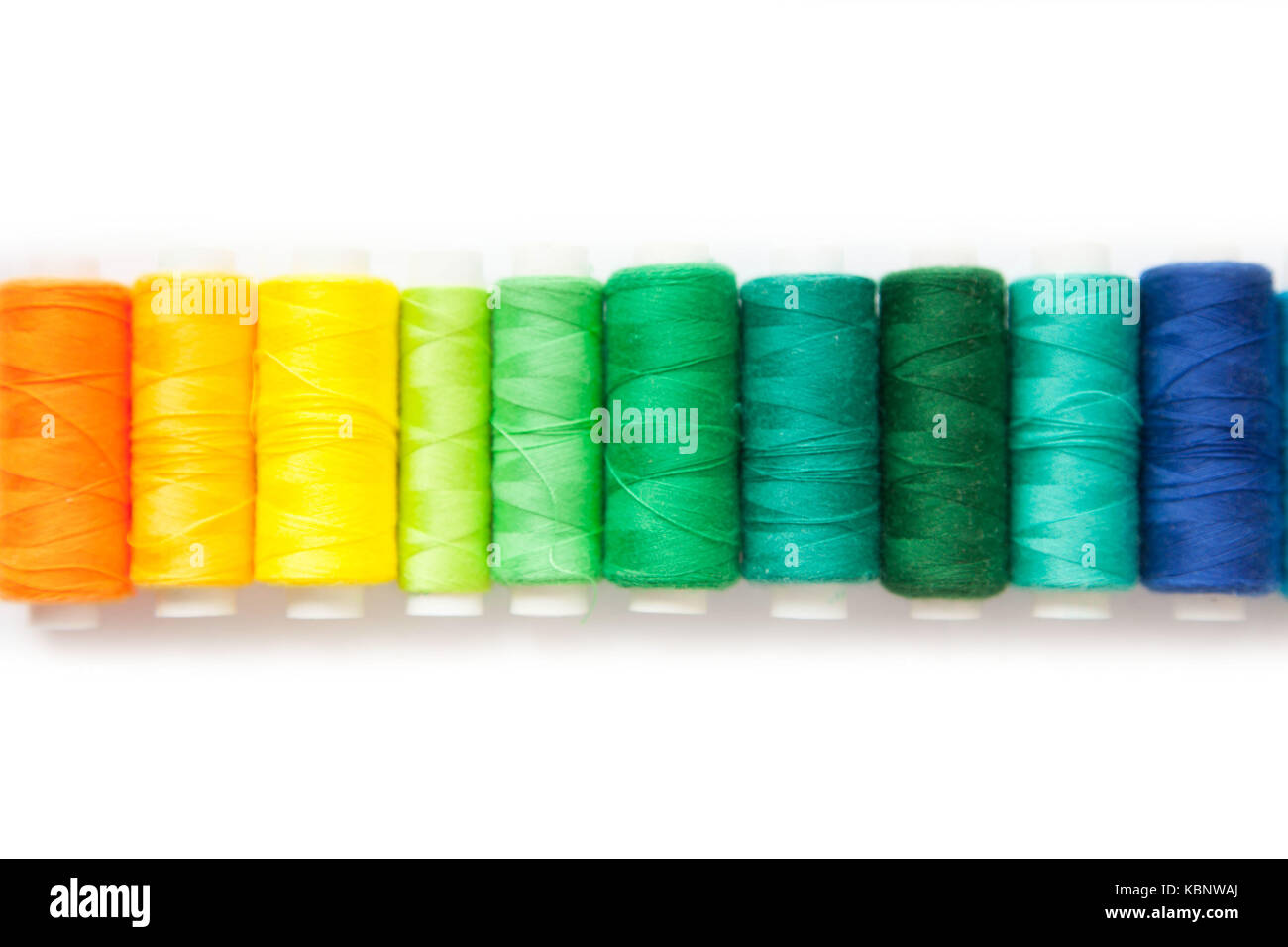 Color thread for sewing. White background Stock Photo - Alamy