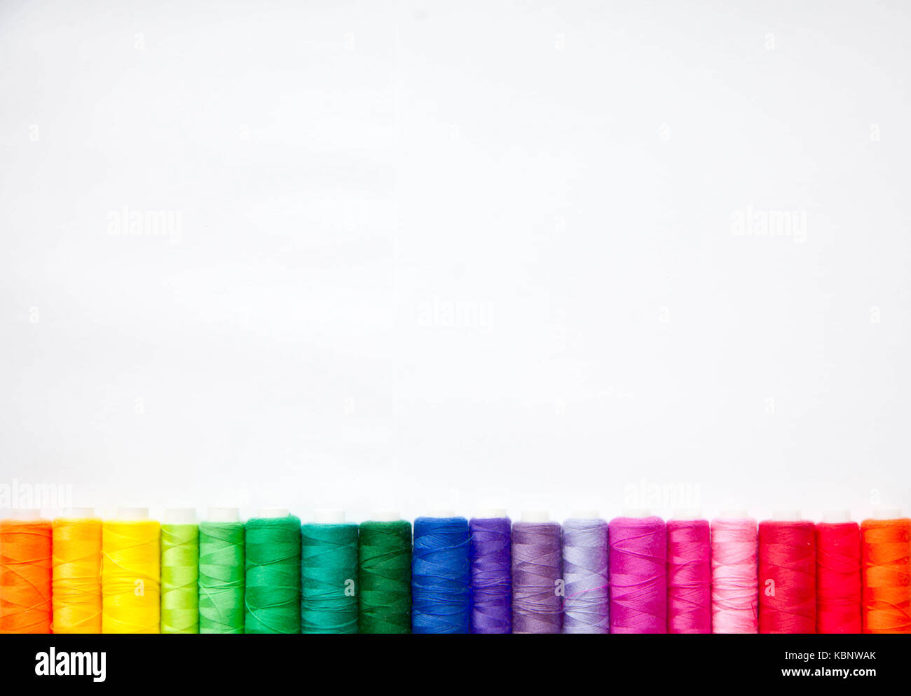 Color thread for sewing. White background Stock Photo - Alamy
