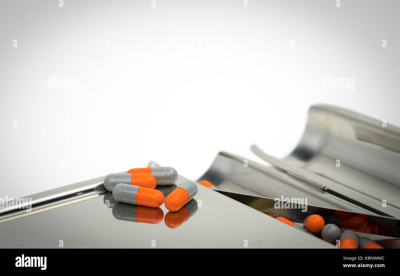 Colorful of antibiotic capsules pills with shadows on stainless steel ...