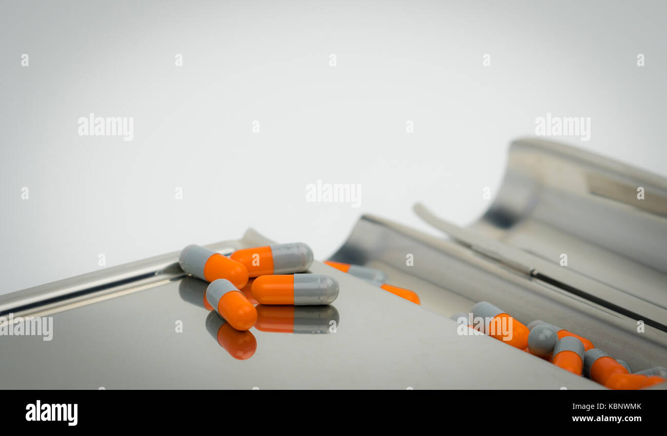 Colorful of antibiotic capsules pills with shadows on stainless steel ...