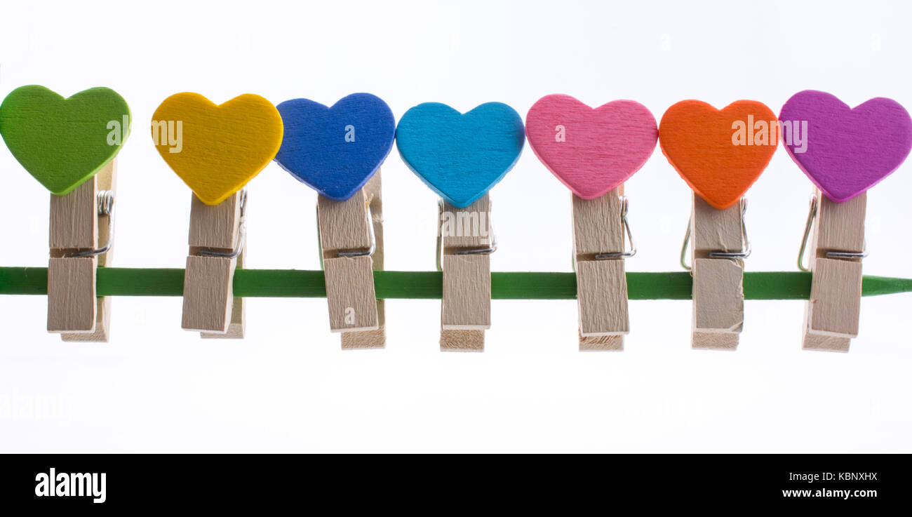 Colorful clothespin attached attached on a line side by side Stock ...