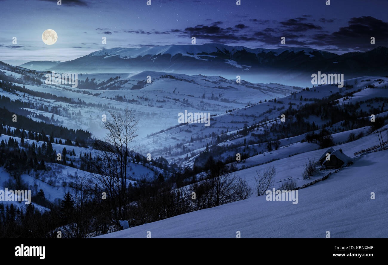 beautiful countryside in mountains at night. village and rural fields ...