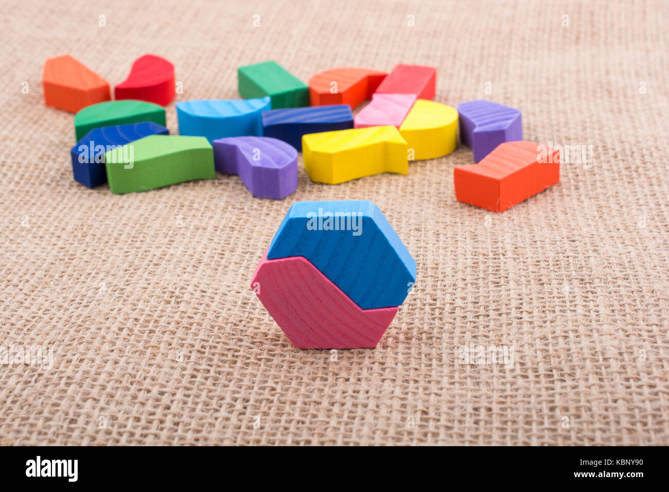 Colorful wooden pieces of a logic puzzle Stock Photo - Alamy