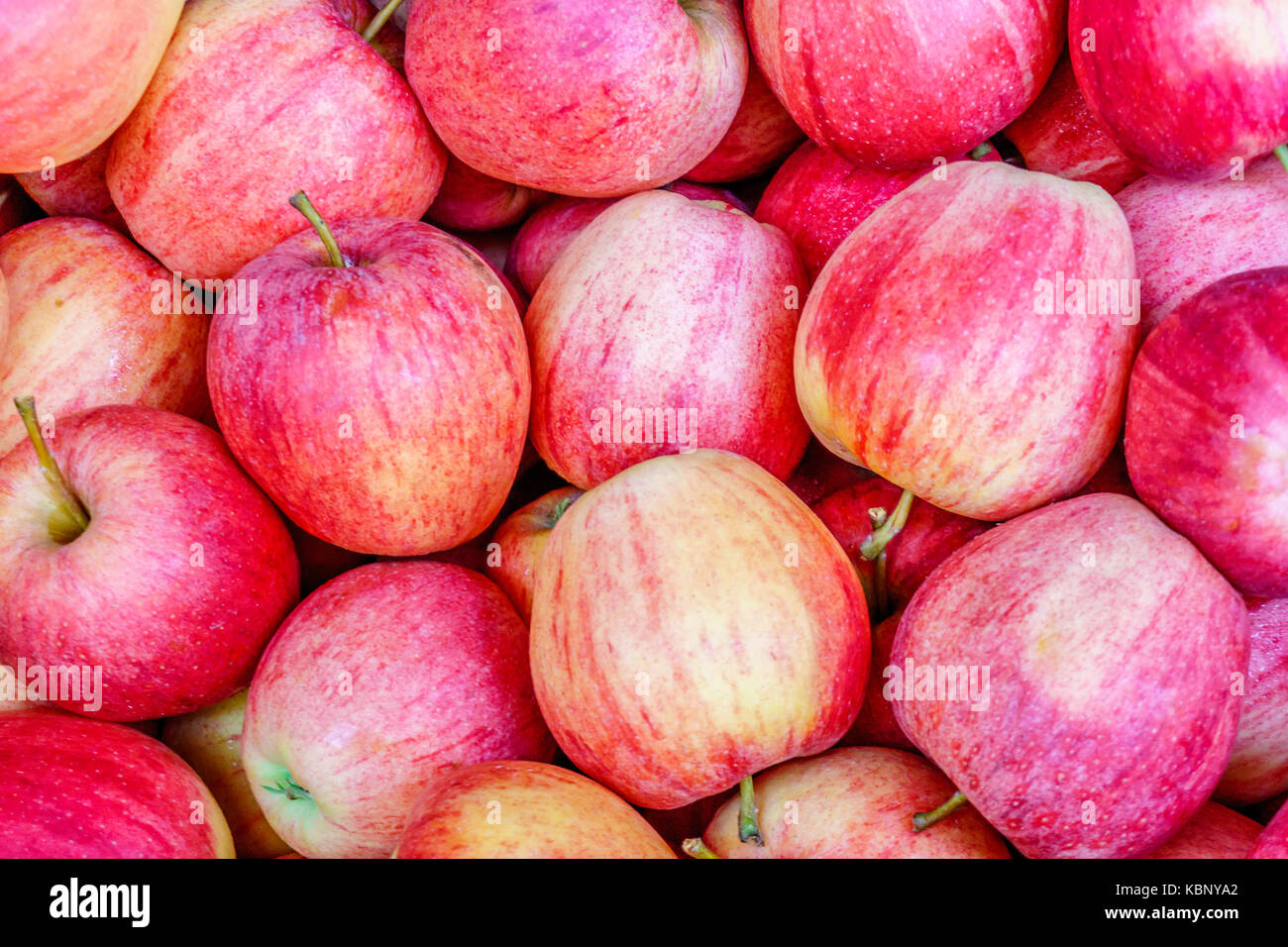 Red apples background Stock Photo - Alamy