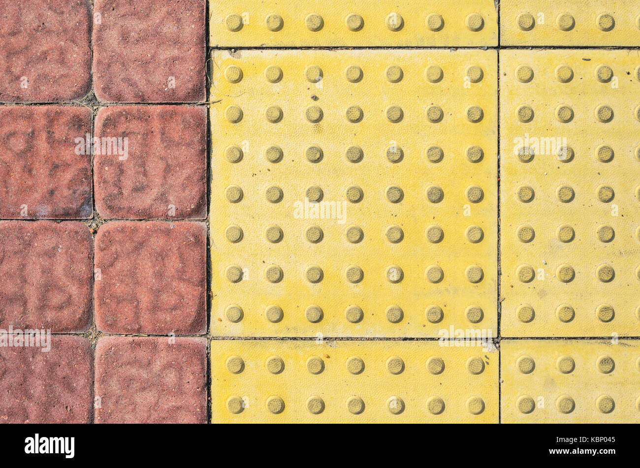 Tactile Paving Slabs on the Sidewalk of Square Red Paving Stones ...