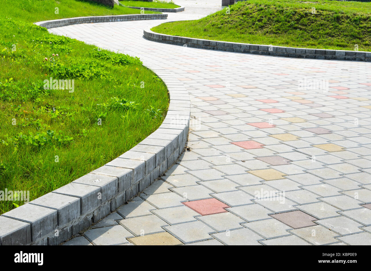 Curved Garden Stone Path Pesperctive View. Multicolored Sidewalk Tile ...