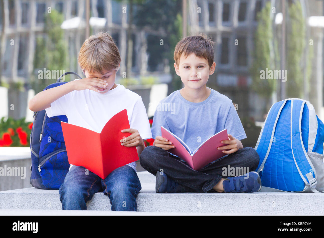 Boys together reading books hi-res stock photography and images - Alamy
