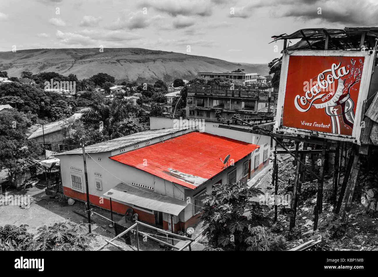 Stylized photo in black and white with red roof and Coca Cola ...