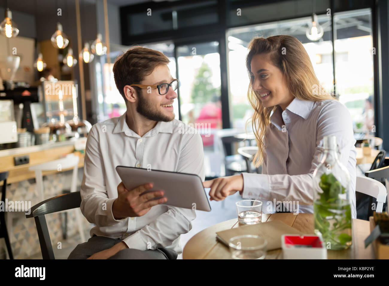 Business people talking and laughing together Stock Photo - Alamy