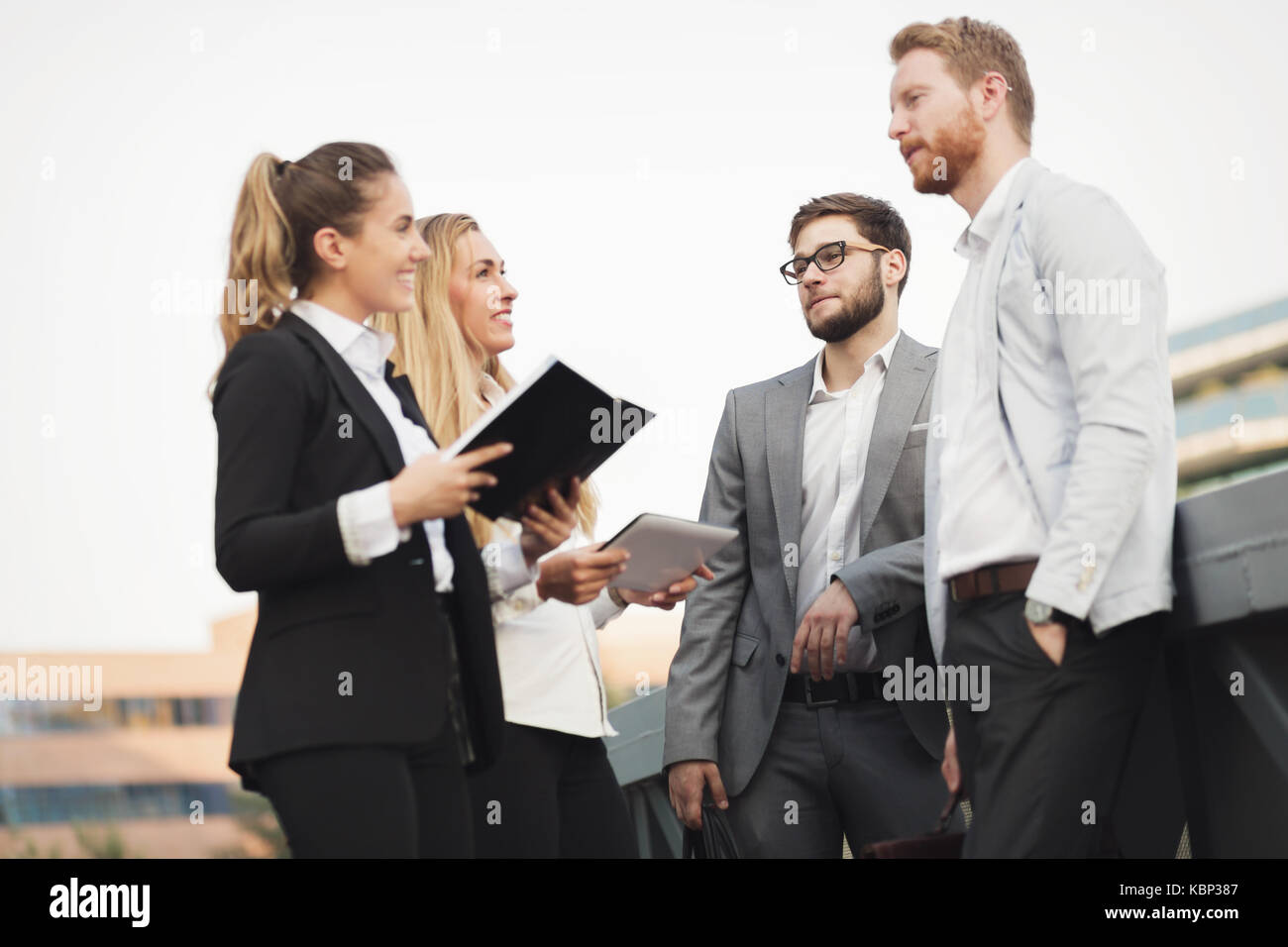 Group of business people outdoor Stock Photo - Alamy