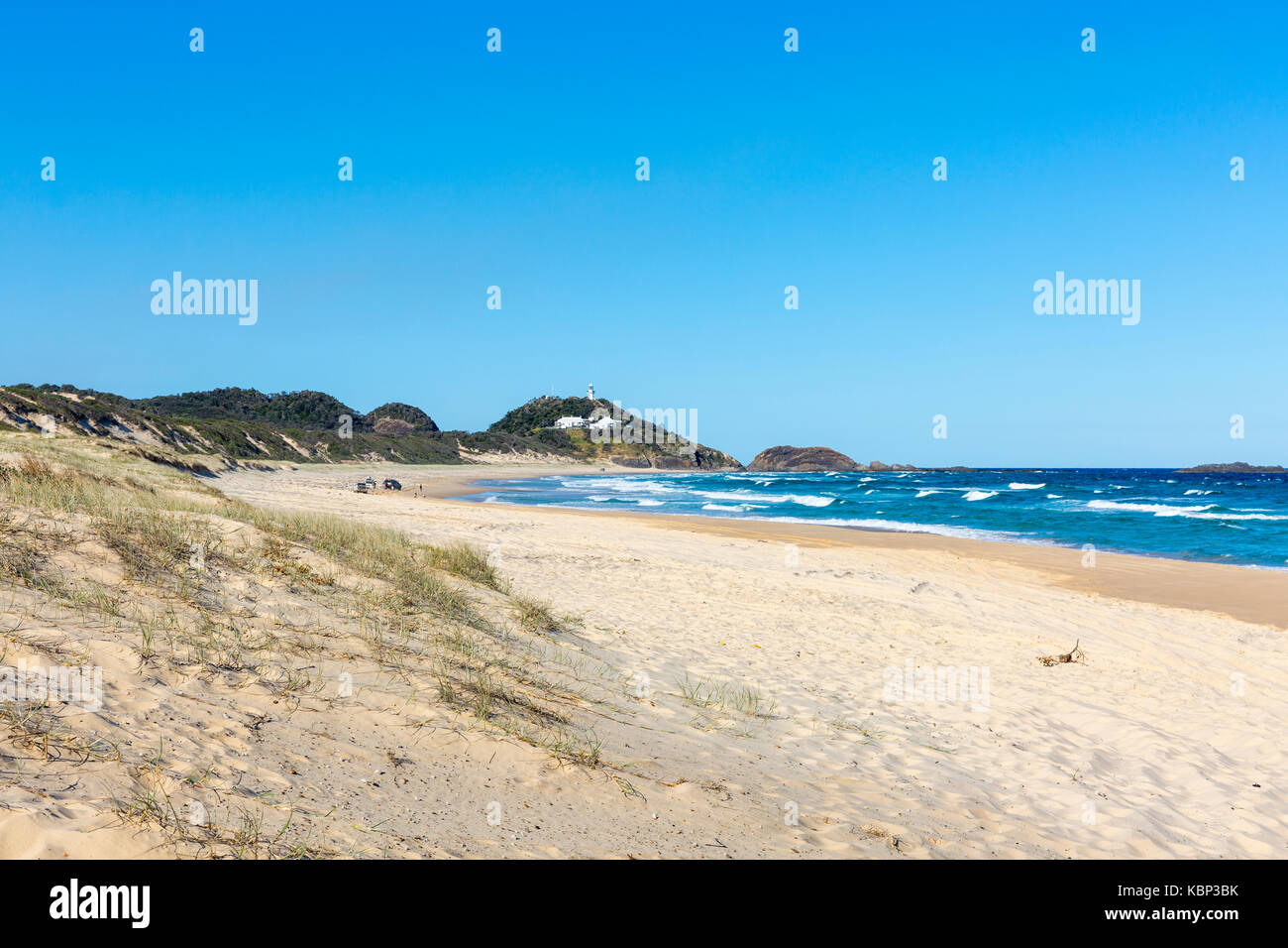 Lighthouse beach with Sugarloaf Point lighthouse in the distance at ...