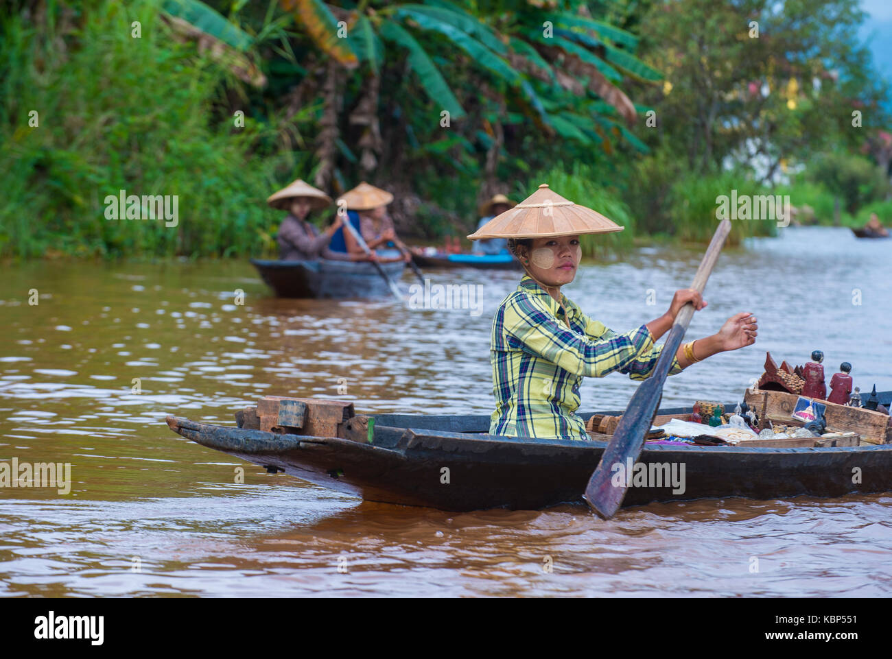 Intha woman on her boat in Inle lake Myanmar Stock Photo - Alamy