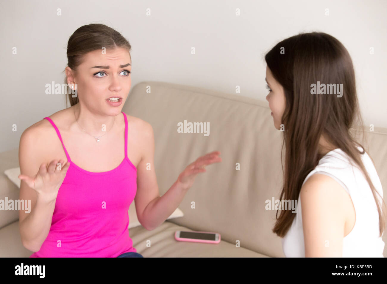 Young girl telling her girlfriend about her problems Stock Photo - Alamy