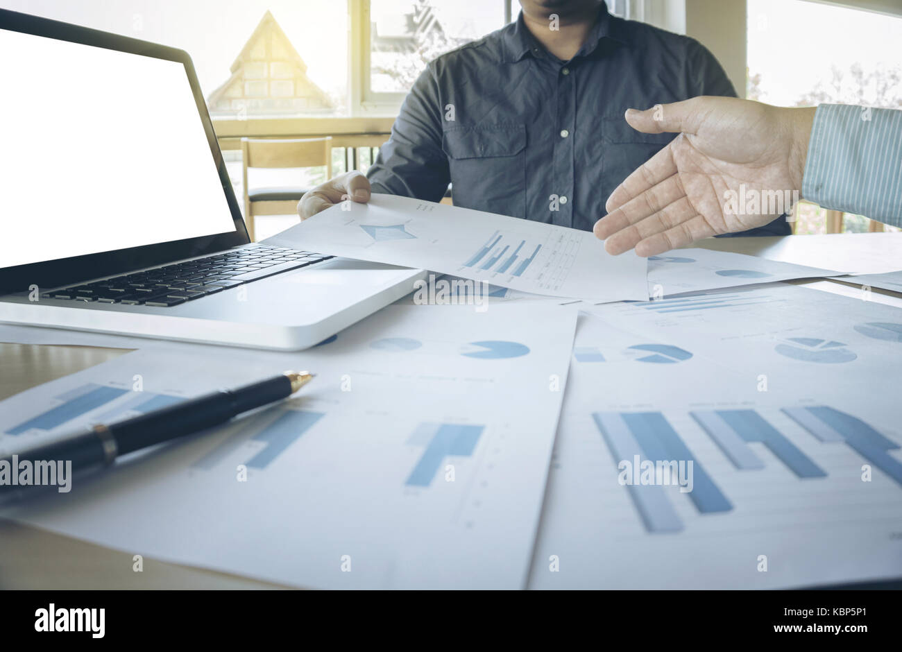 Business team colleagues discussing working with many document graph in ...
