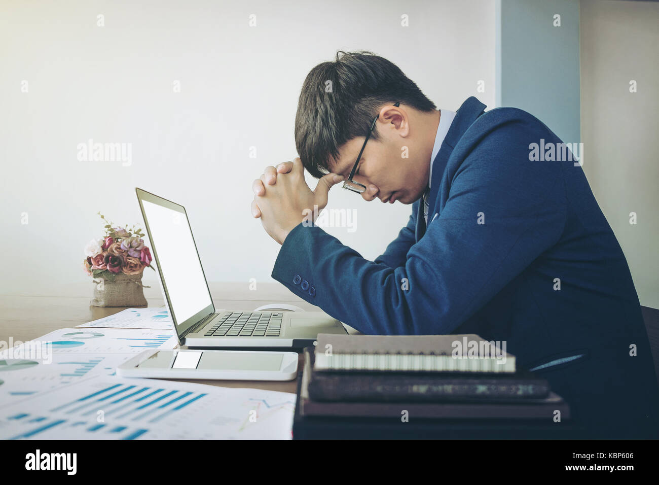 Businessman stressed out at work in casual office Stock Photo - Alamy