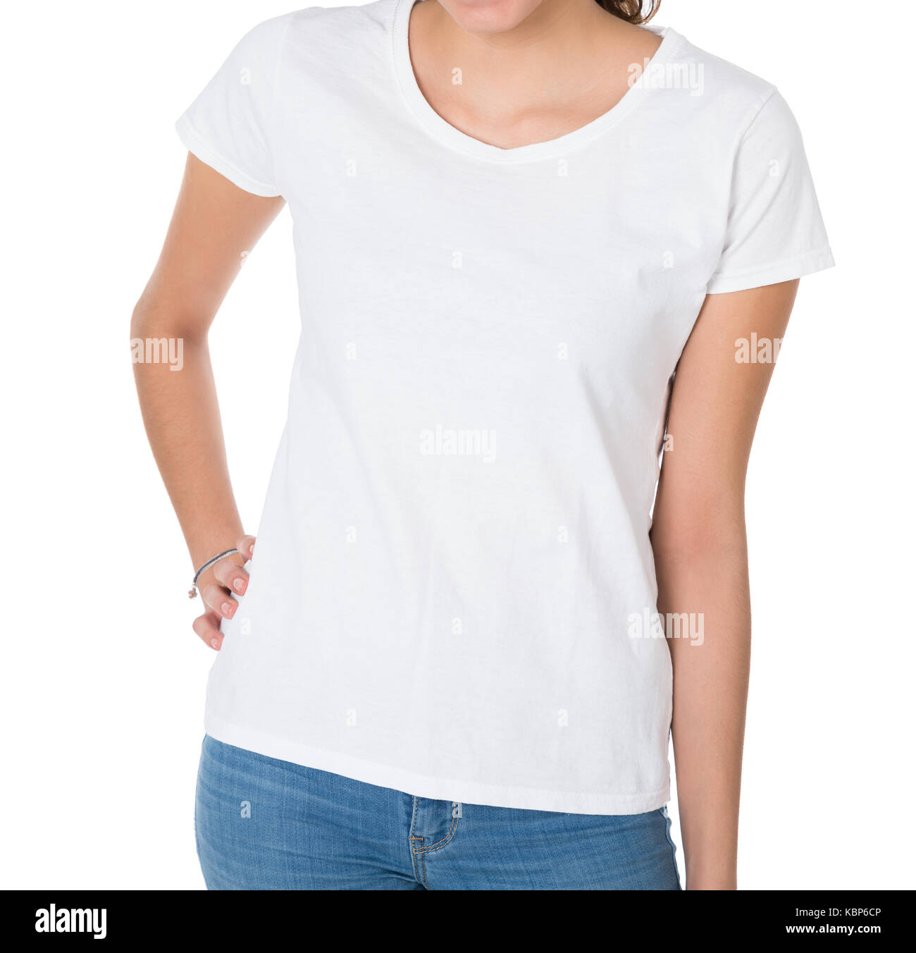 Midsection of young woman wearing blank tshirt on white background ...