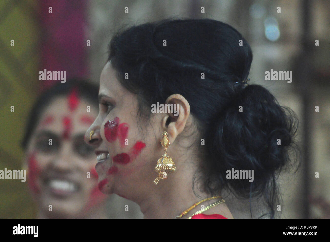 Agartala, India. 30th Sep, 2017. Hindu women smear vermilion powder on ...