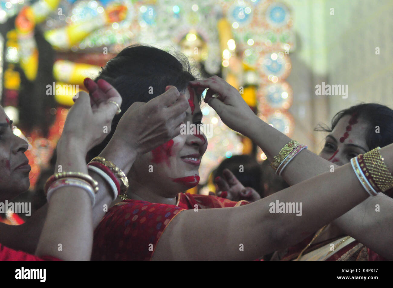 Agartala, India. 30th Sep, 2017. Hindu women smear vermilion powder on ...