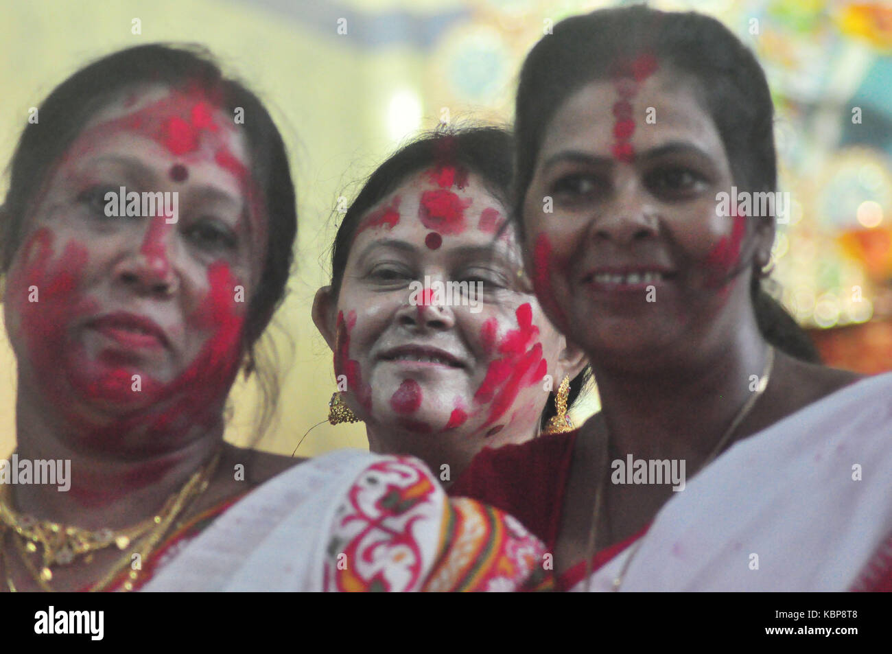 Agartala, India. 30th Sep, 2017. Hindu women smear vermilion powder on ...