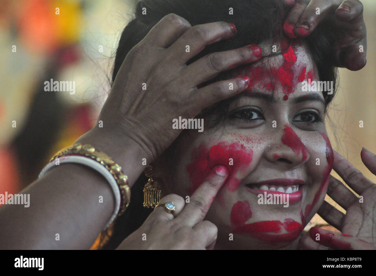 Agartala, India. 30th Sep, 2017. Hindu women smear vermilion powder on ...