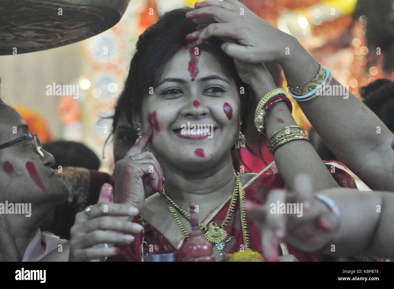 Agartala, India. 30th Sep, 2017. Hindu women smear vermilion powder on ...
