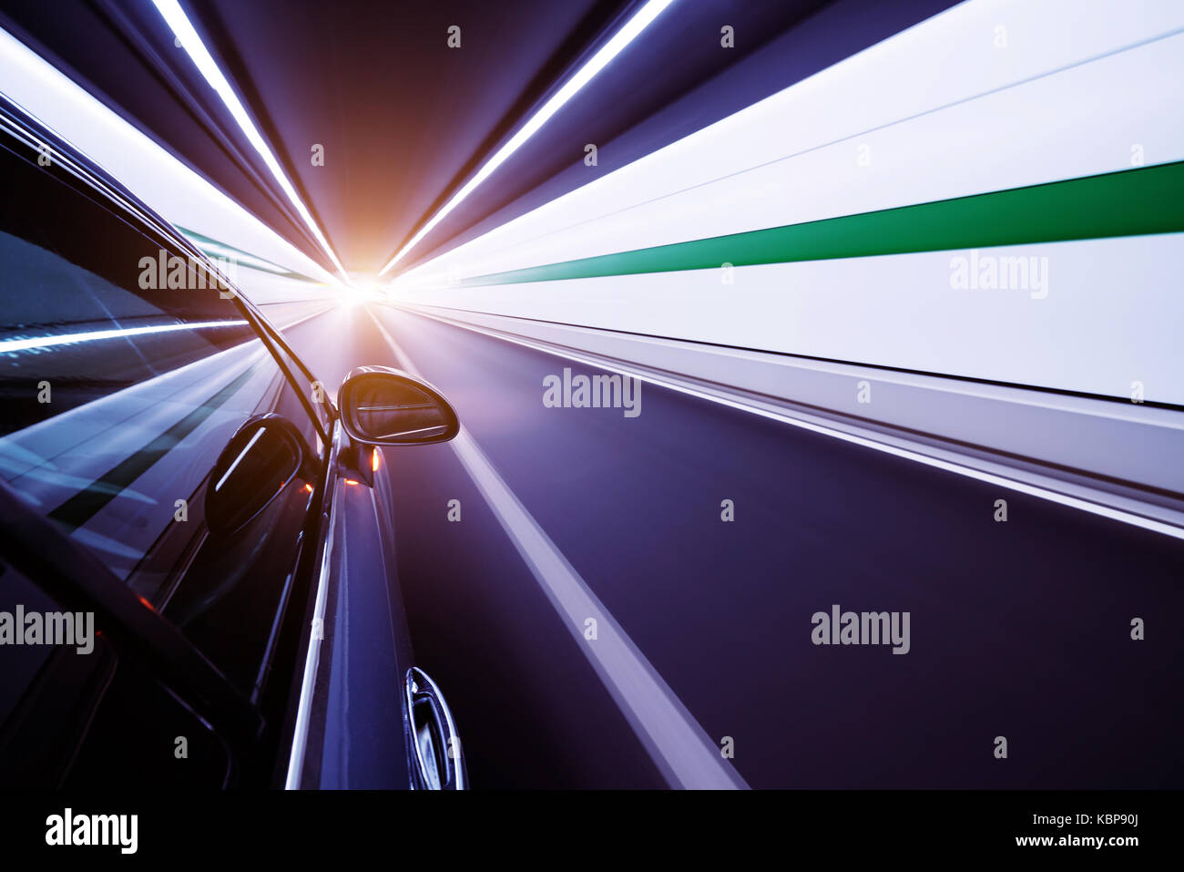 A car driving on a motorway at high speeds, overtaking other cars Stock ...