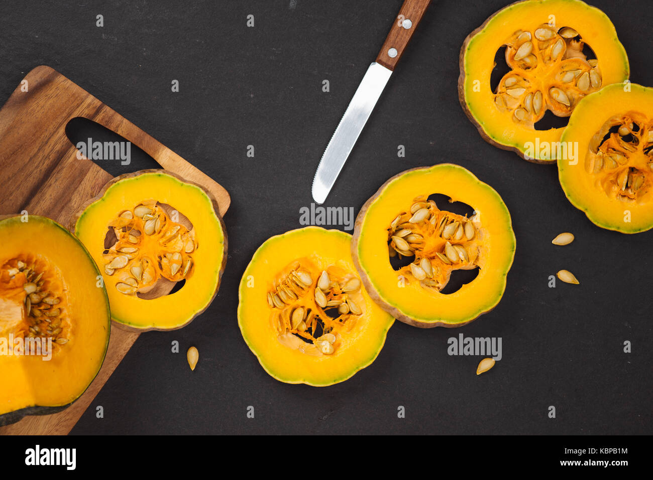 Delicious fresh pieces of ripe pumpkin on wooden background Stock Photo ...