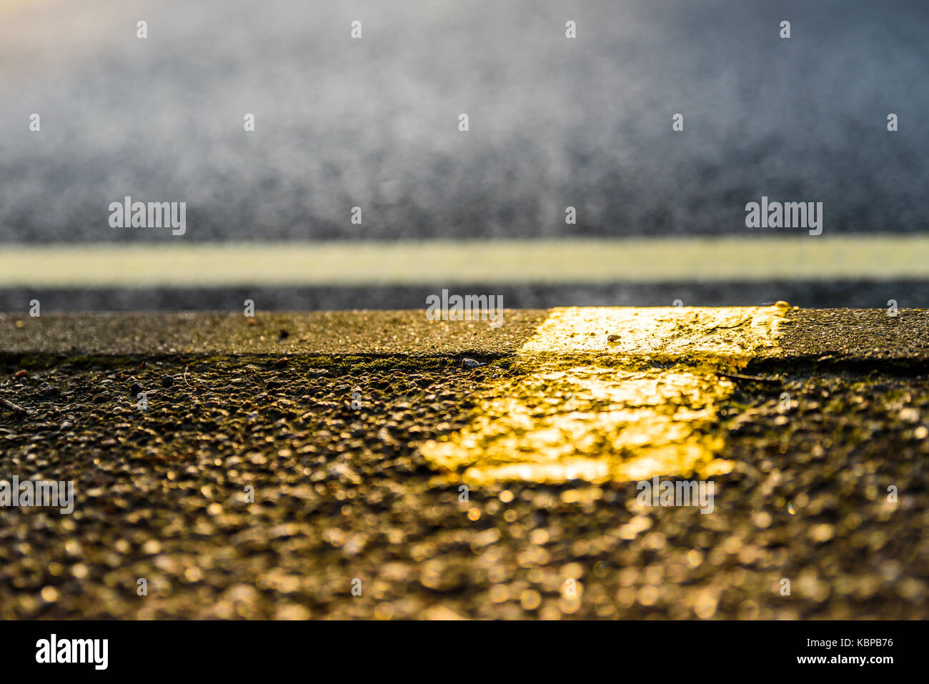 Closeup view yellow road marking line Stock Photo - Alamy
