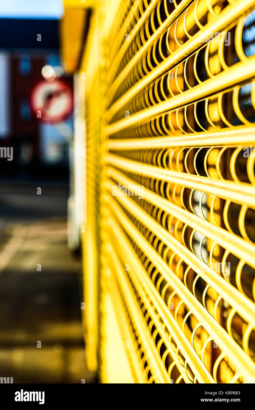 Day view closeup of yellow shop warehouse shutter metal door Stock ...