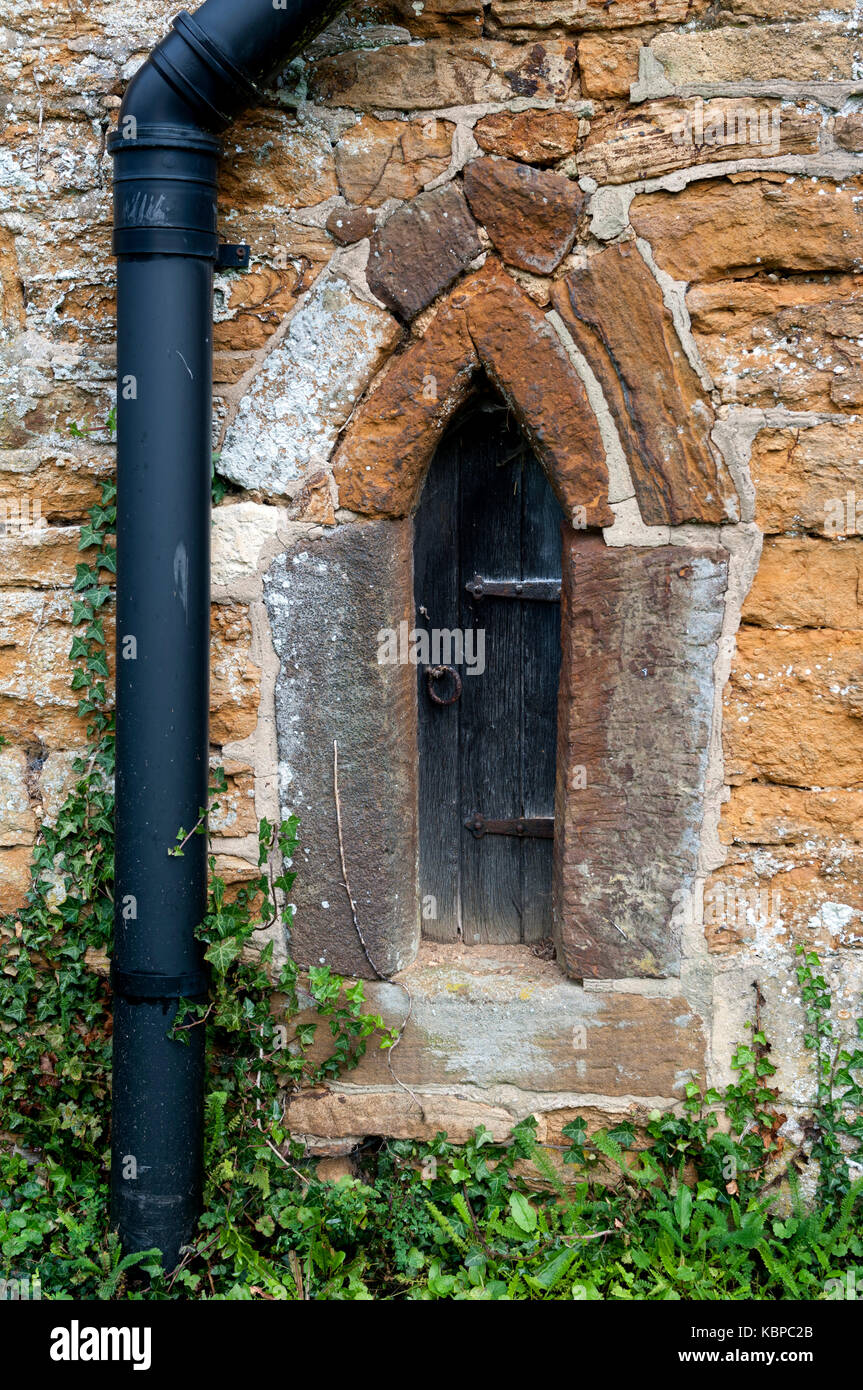 Tiny doorway in St. Luke`s Church, Cold Higham, Northamptonshire ...