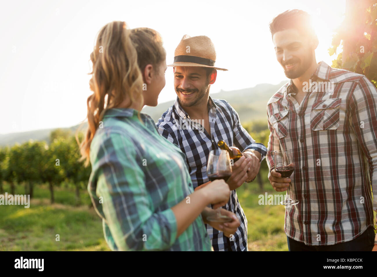 People tasting wine in vineyard Stock Photo - Alamy